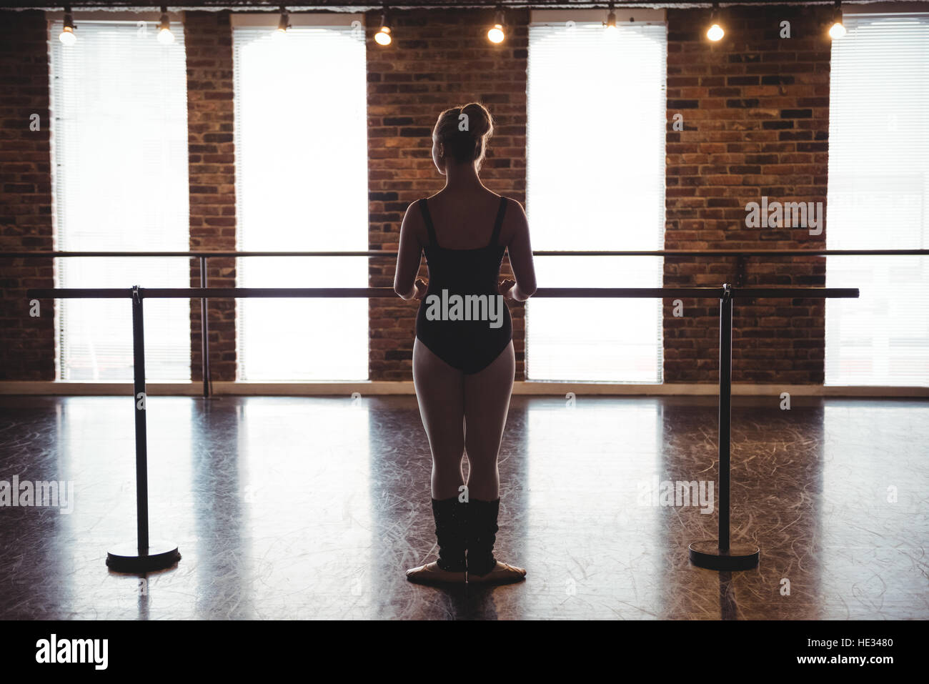 Rear view of ballerina standing in ballet studio Stock Photo - Alamy