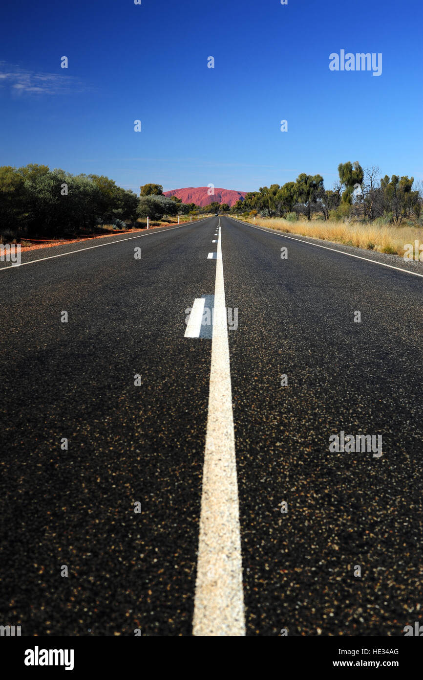 Uluru Road to Red rock of Alice Spring, Yulara Stock Photo - Alamy