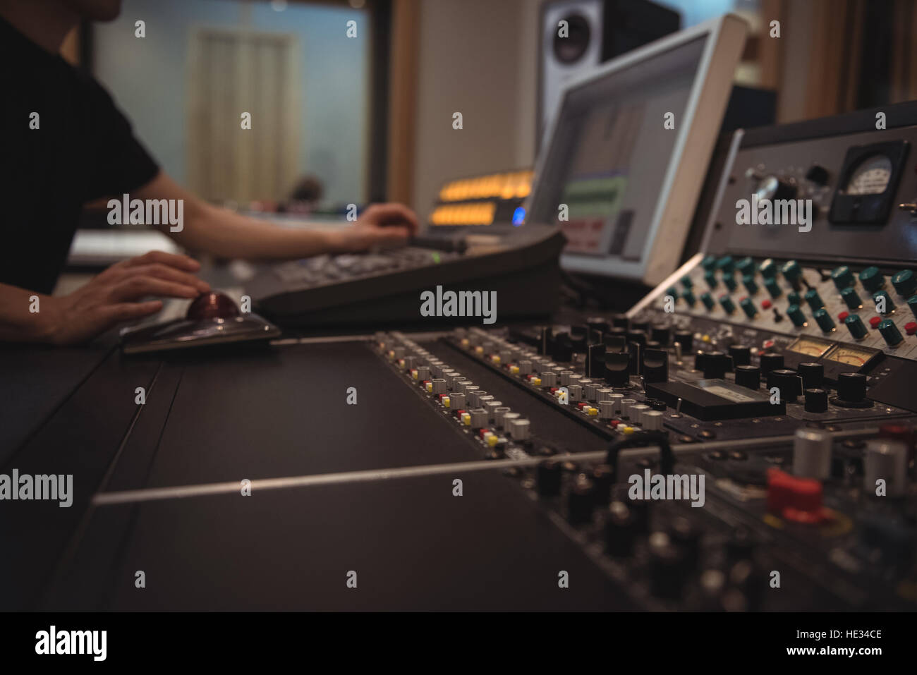 Audio engineer using sound mixer in recording studio Stock Photo - Alamy