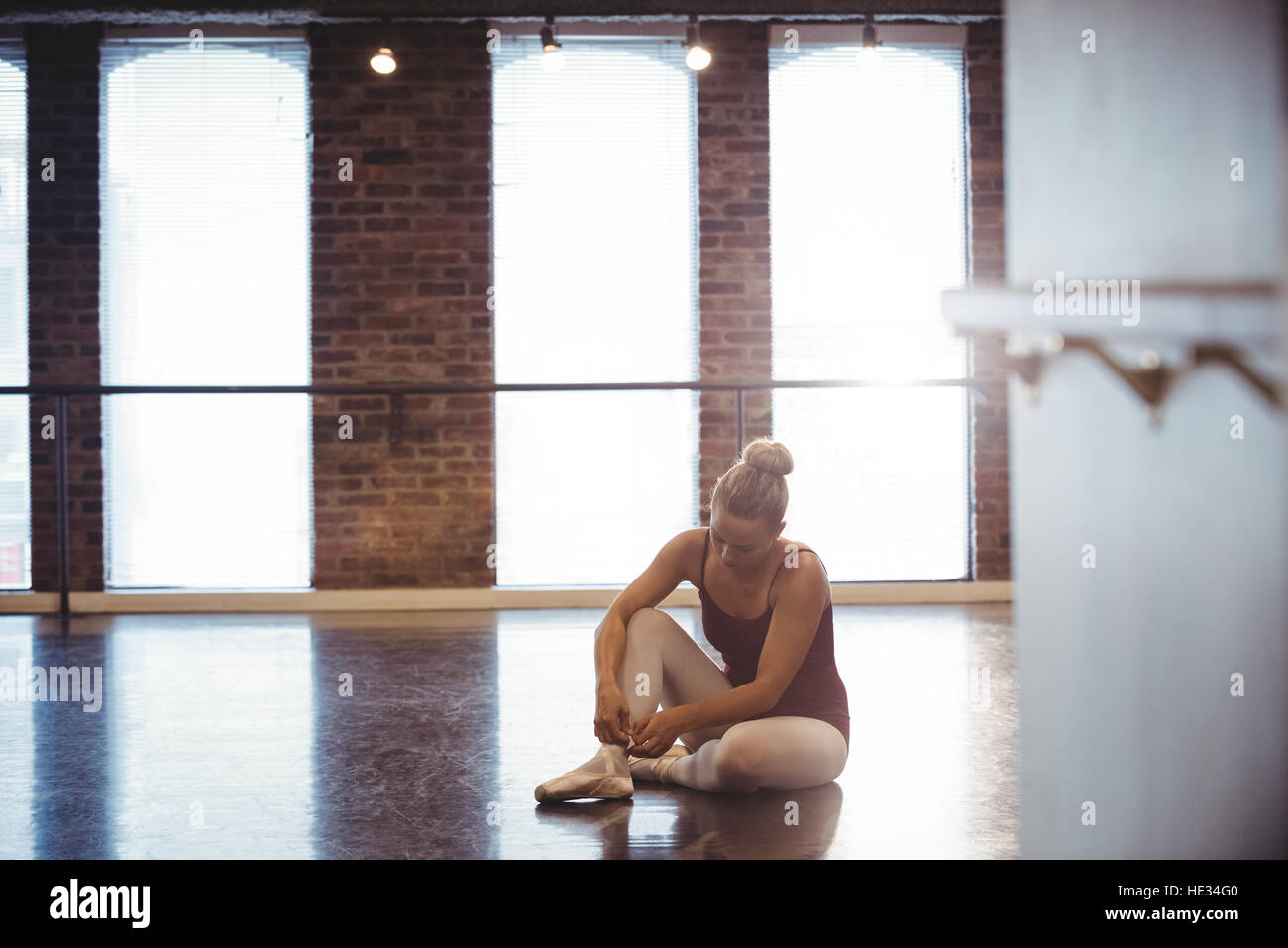 Ballerina wearing ballet shoes in the studio Stock Photo - Alamy