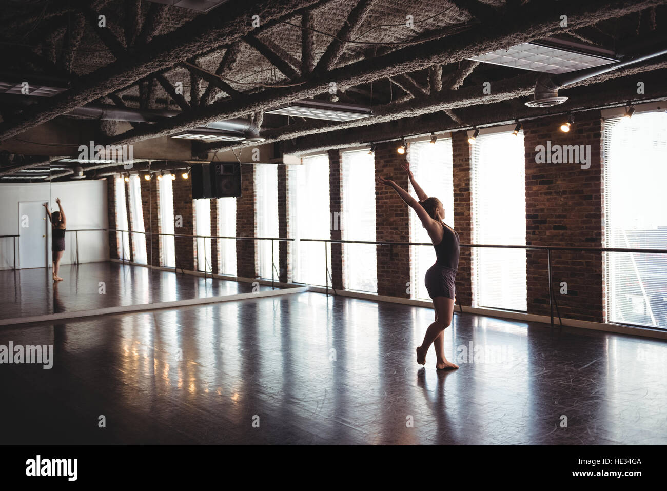 Woman practicing dance in dance studio Stock Photo - Alamy