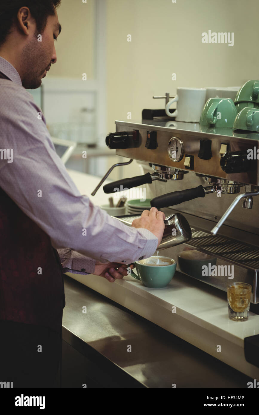 Man in cafe preparing coffee in the coffee shop Stock Photo - Alamy