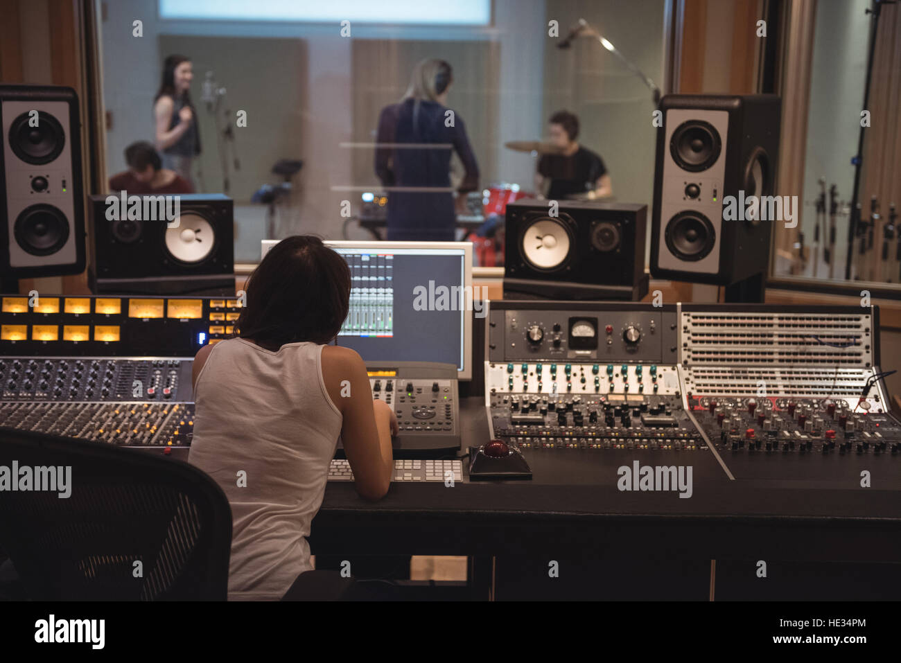 Audio engineer using sound mixer in recording studio Stock Photo - Alamy