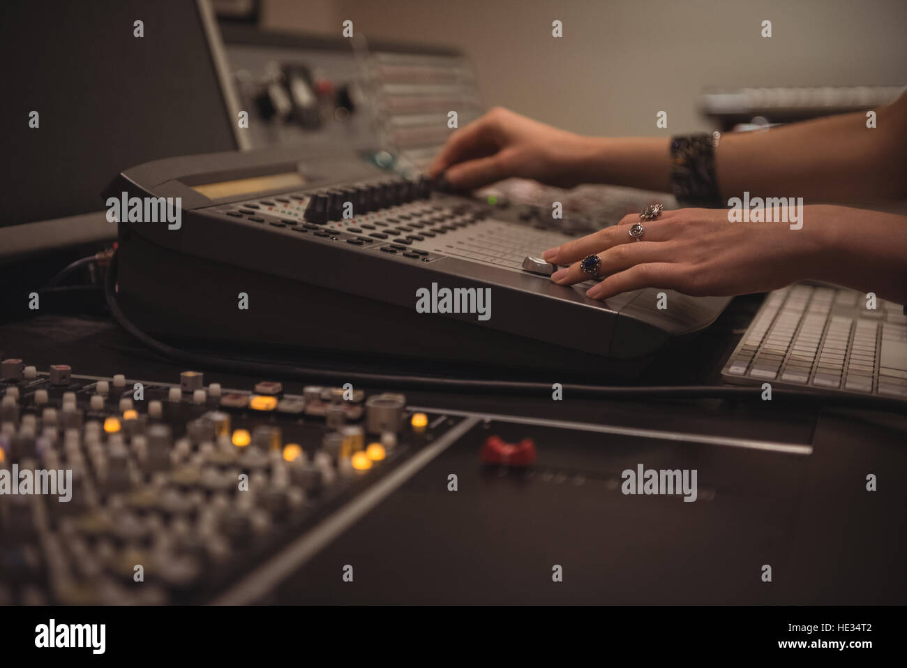 Audio engineer using sound mixer in recording studio Stock Photo - Alamy