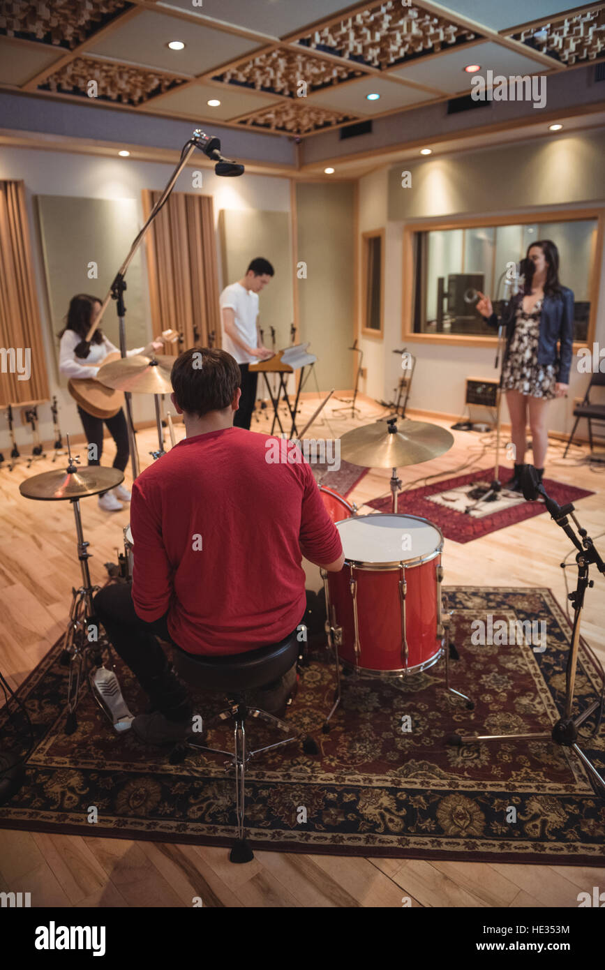 Music band performing in a recording studio Stock Photo - Alamy