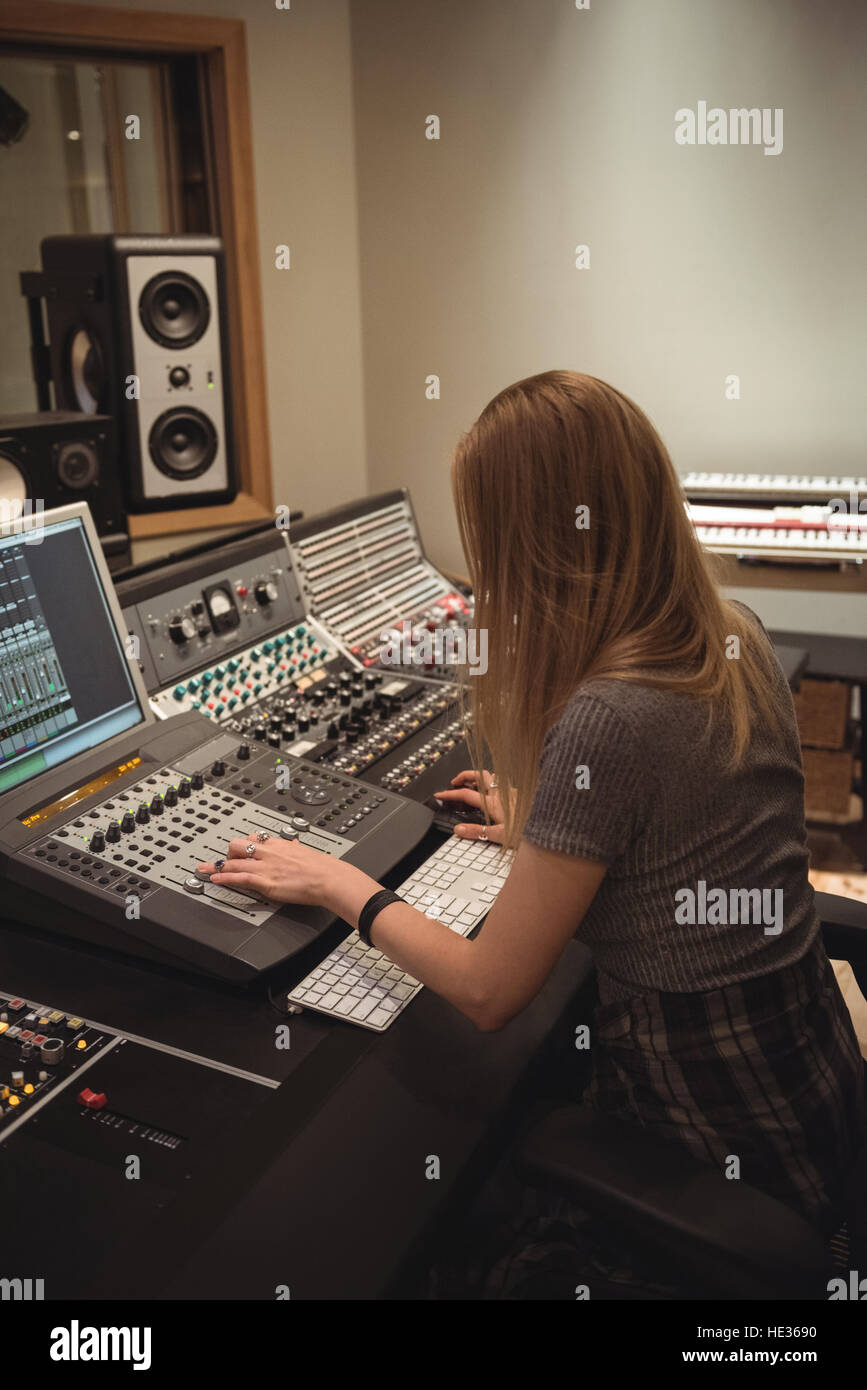 Audio engineer using sound mixer in recording studio Stock Photo - Alamy