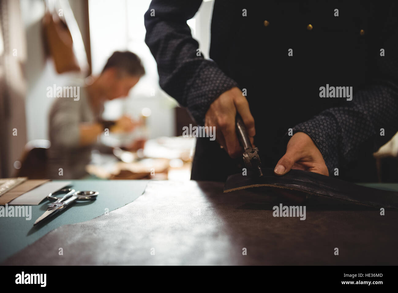 Tool leather hole belt punching hi-res stock photography and images - Alamy