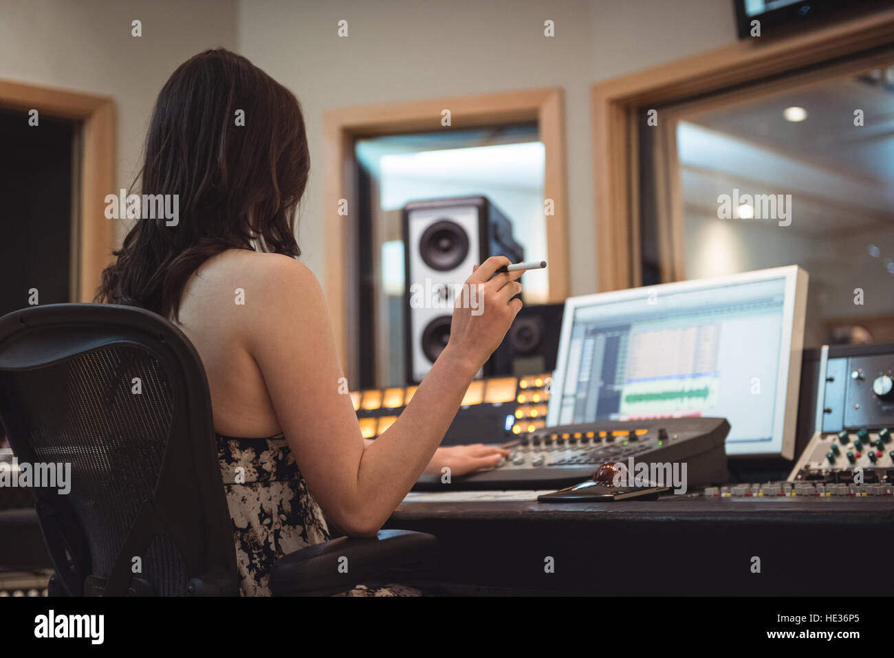 Audio engineer using sound mixer in recording studio Stock Photo - Alamy