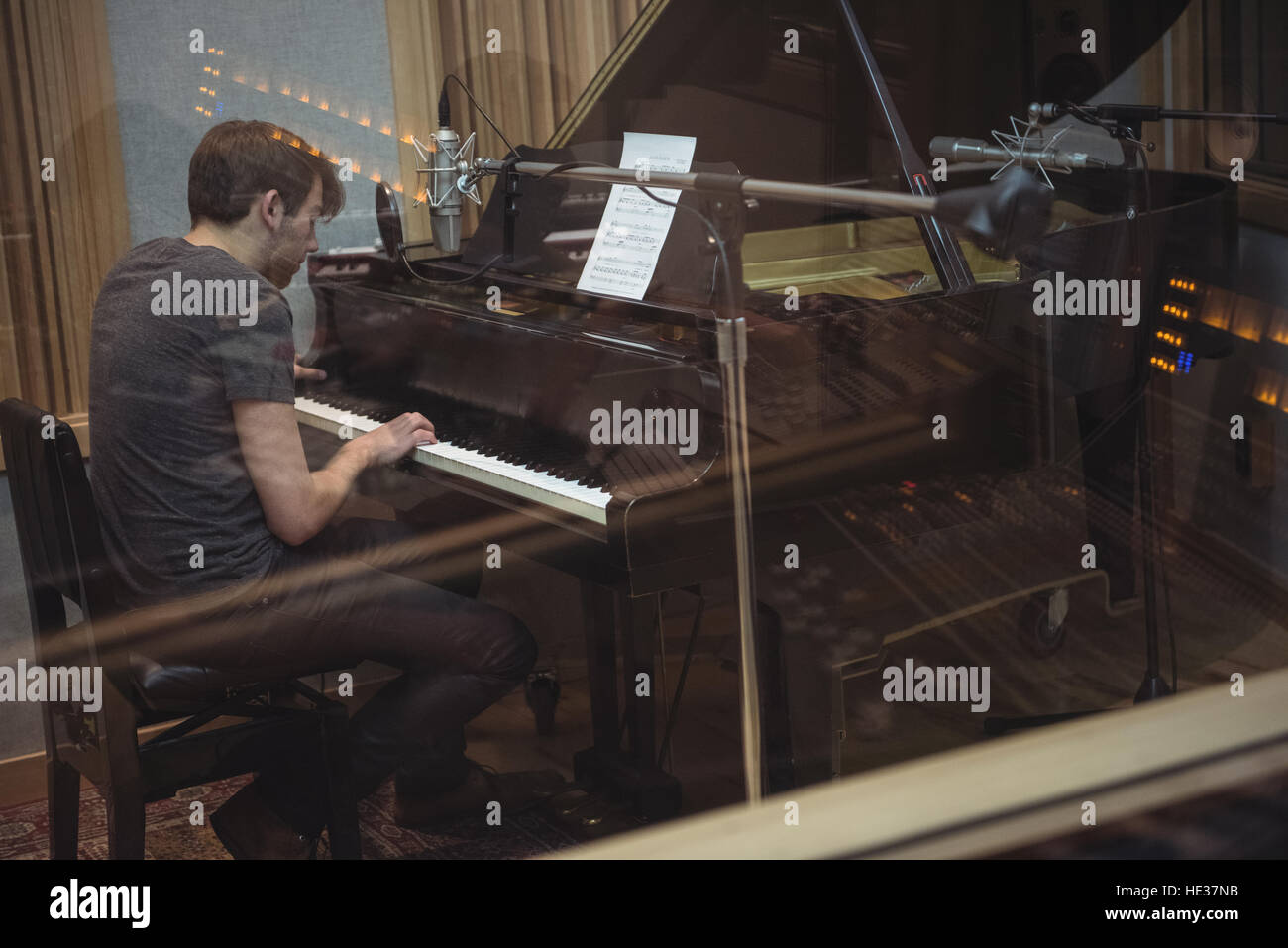 Man playing a piano in music studio Stock Photo - Alamy