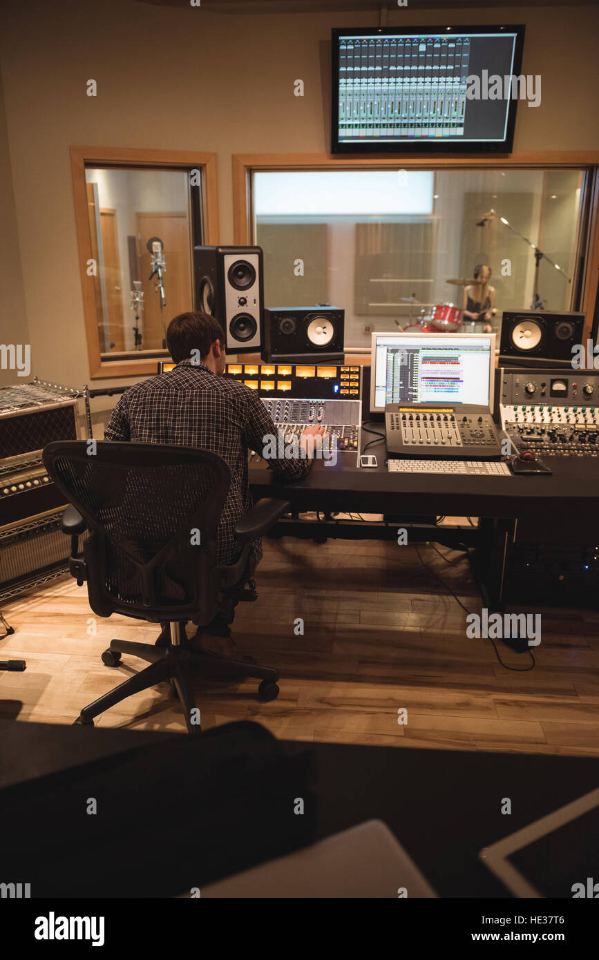 Audio engineer using sound mixer in recording studio Stock Photo - Alamy