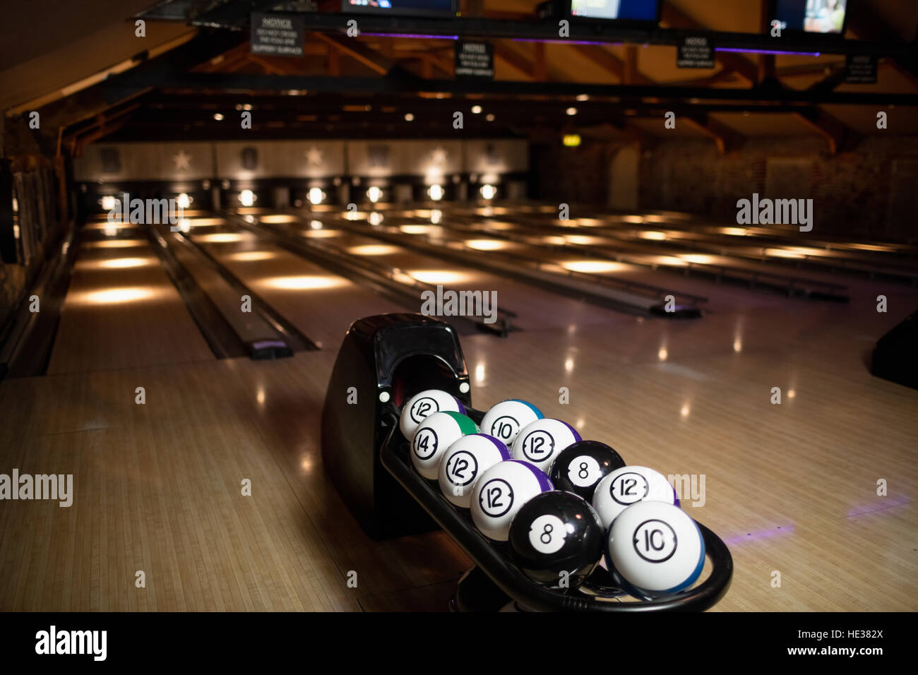 Interior of Empty bowling alley with bowling balls Stock Photo - Alamy