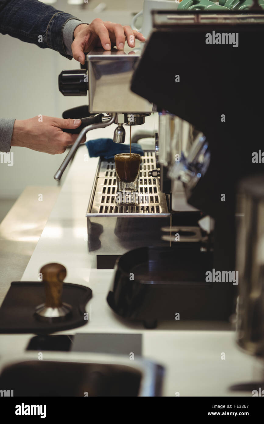 Hand of man preparing coffee at coffee machine in the coffee shop Stock ...