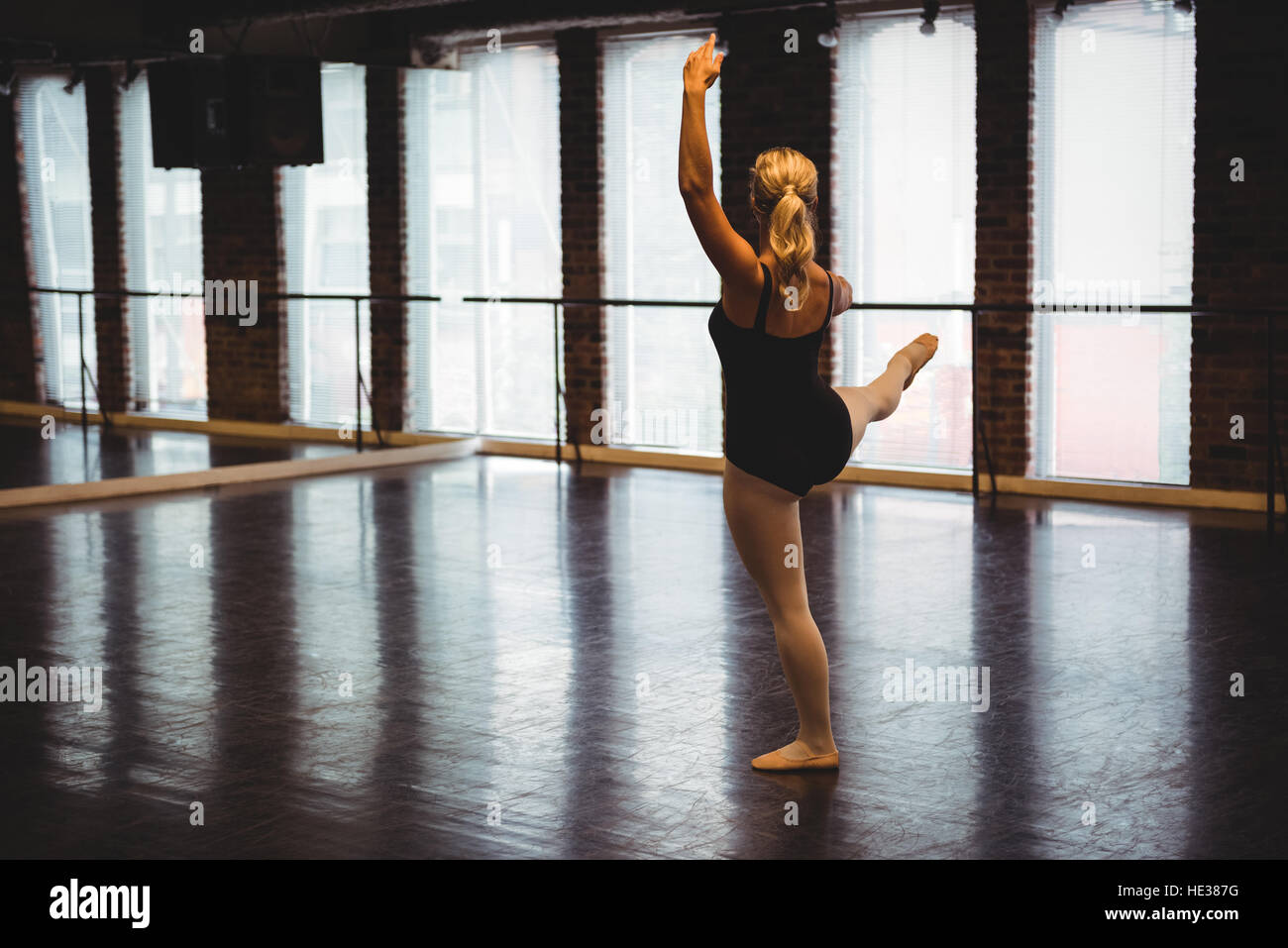 Ballerina performing ballet dance moves in ballet studio Stock Photo ...