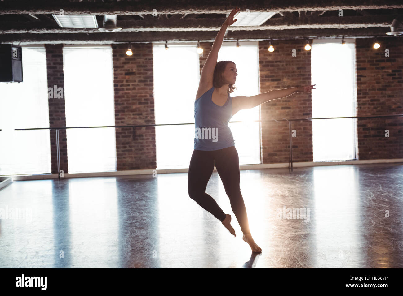 Woman practicing dance in dance studio Stock Photo - Alamy