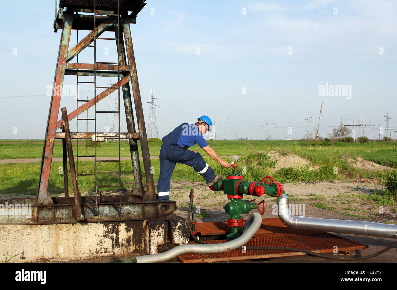 oil worker check pipeline on oilfield Stock Photo - Alamy