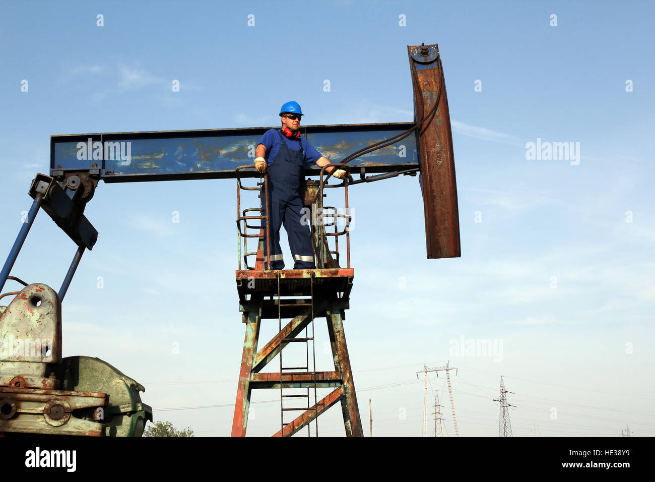 oil worker on pump jack Stock Photo - Alamy