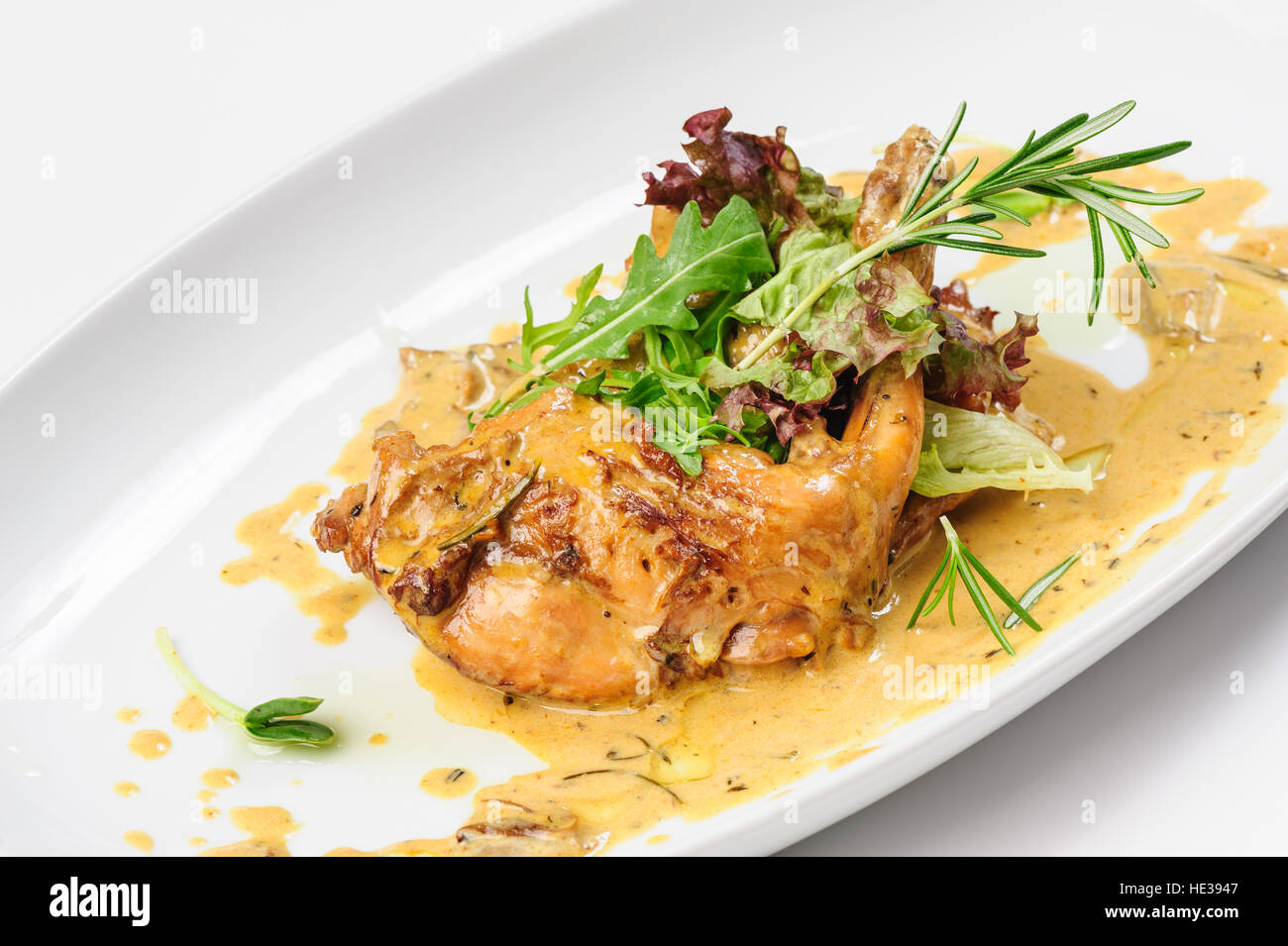 Baked and stewed rabbit legs Stock Photo - Alamy