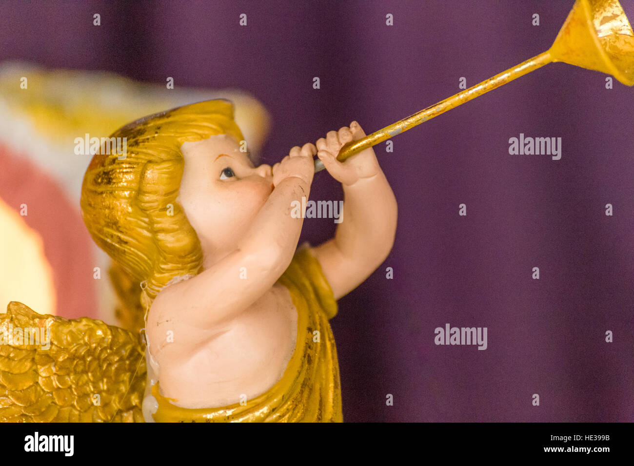 Angel playing trumpet in Christmas crib Stock Photo - Alamy