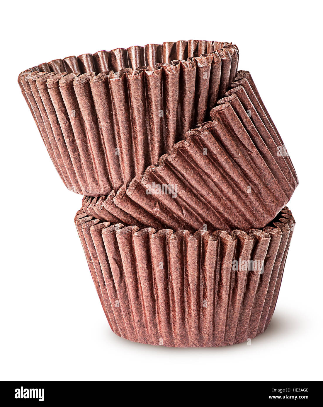 Heap of brown paper cups for baking muffins isolated on white ...