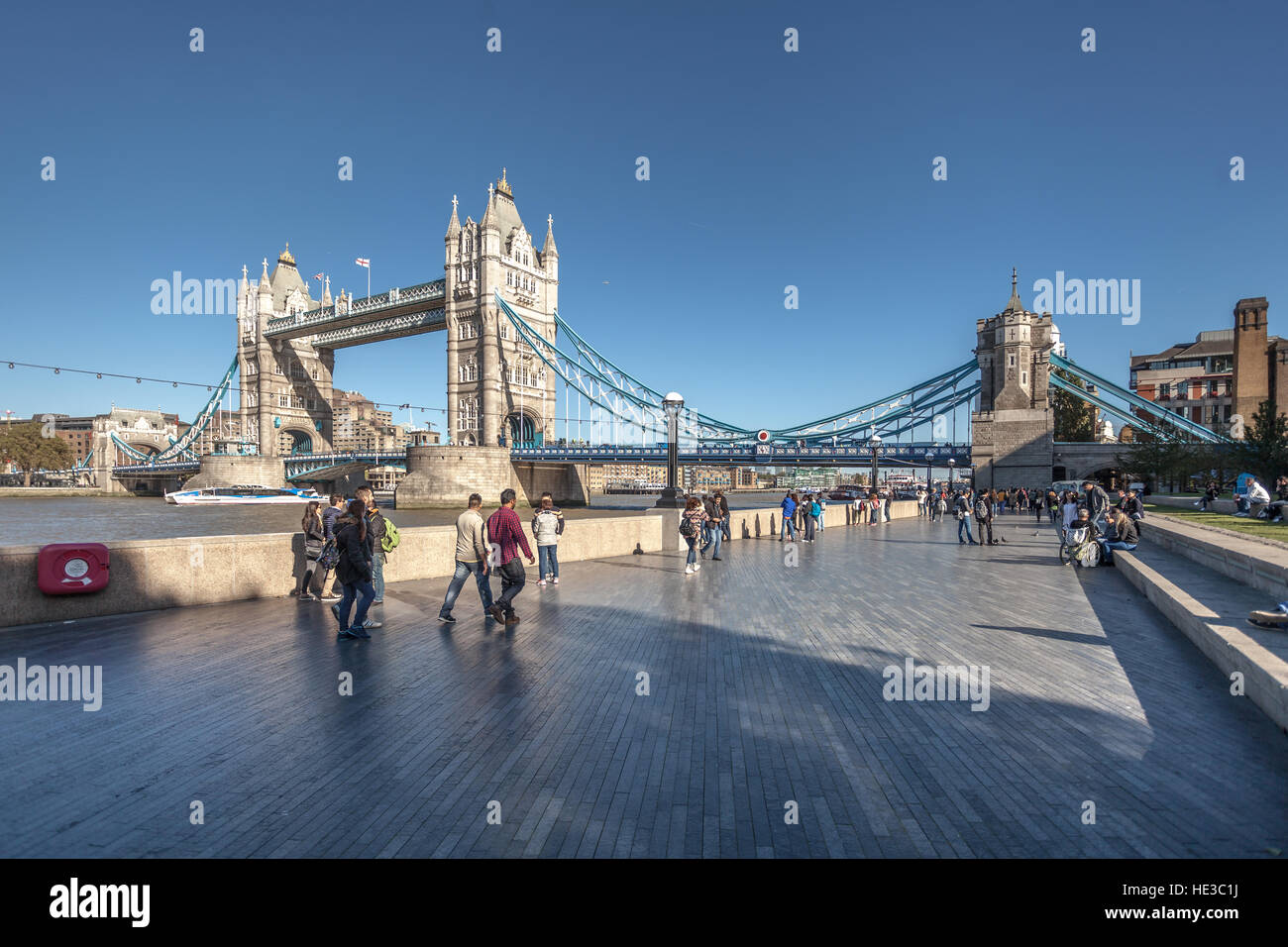 London UK, people walking along Thames near Tower Bridge Stock Photo ...