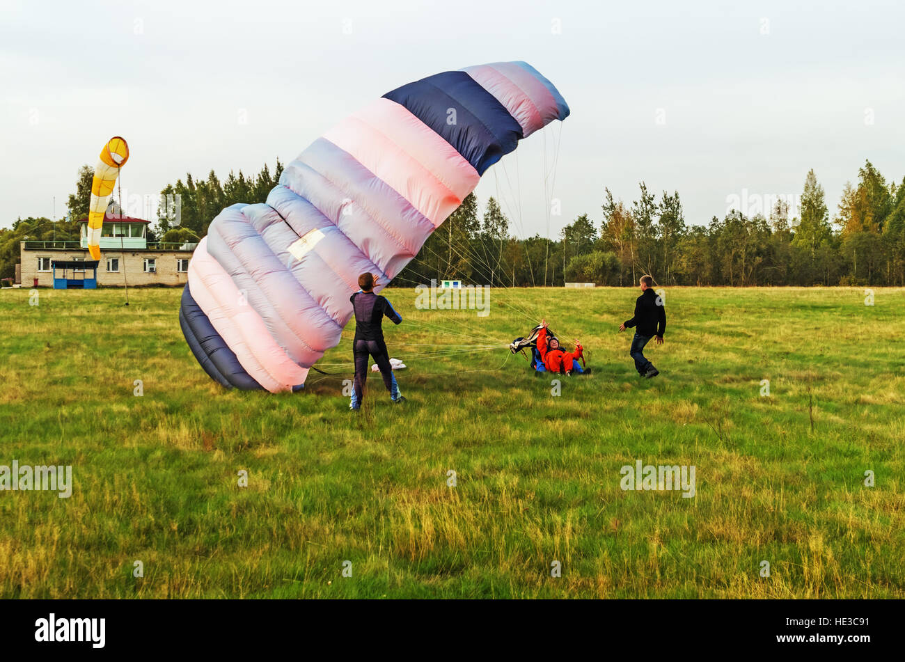 Parachutists - 2014.The skydivers landing under the parachute-tandem ...