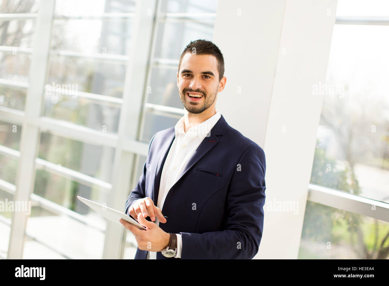 View at businessman using his digital tablet at the office Stock Photo ...