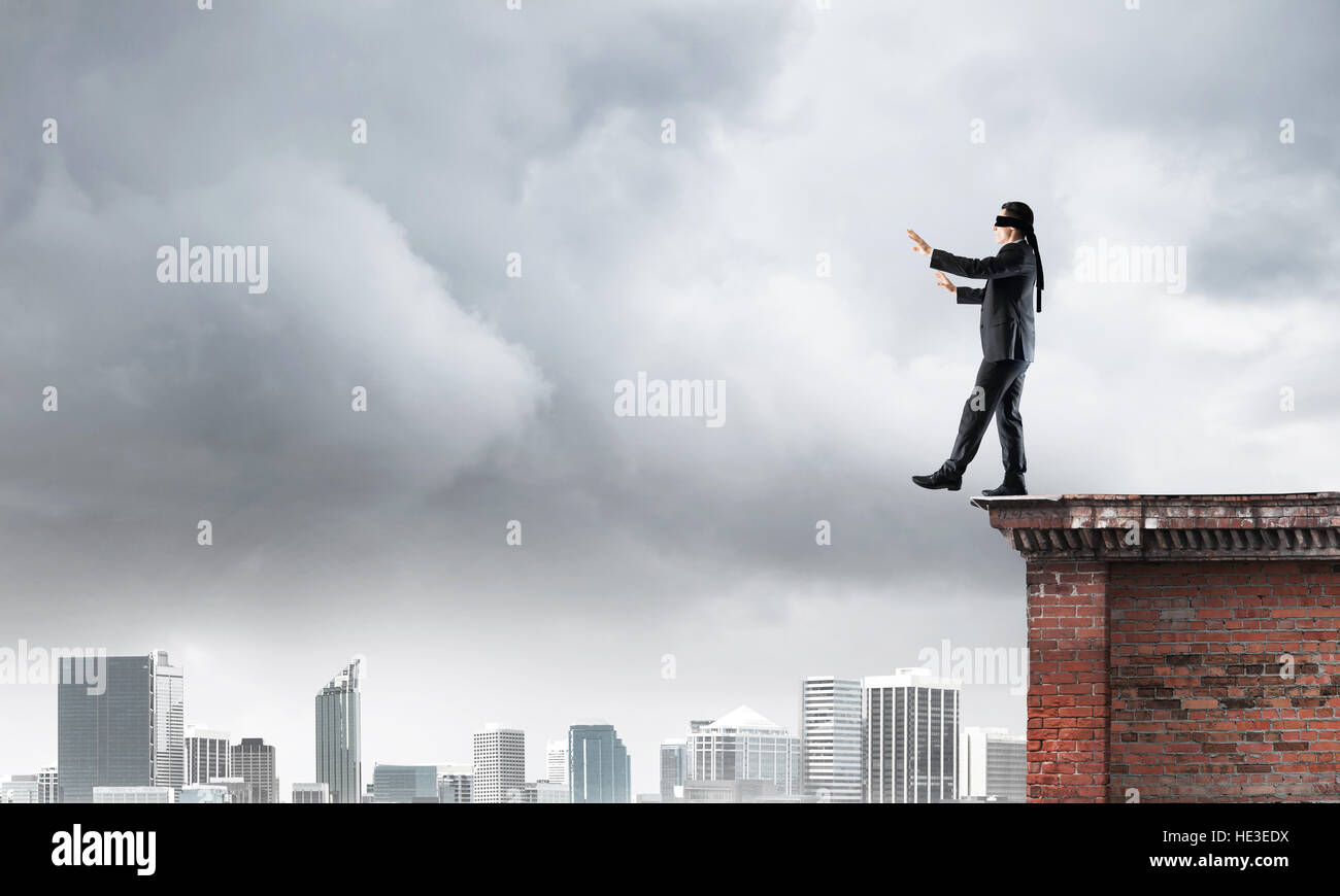Danger and risk concept with businessman making step from edge Stock ...