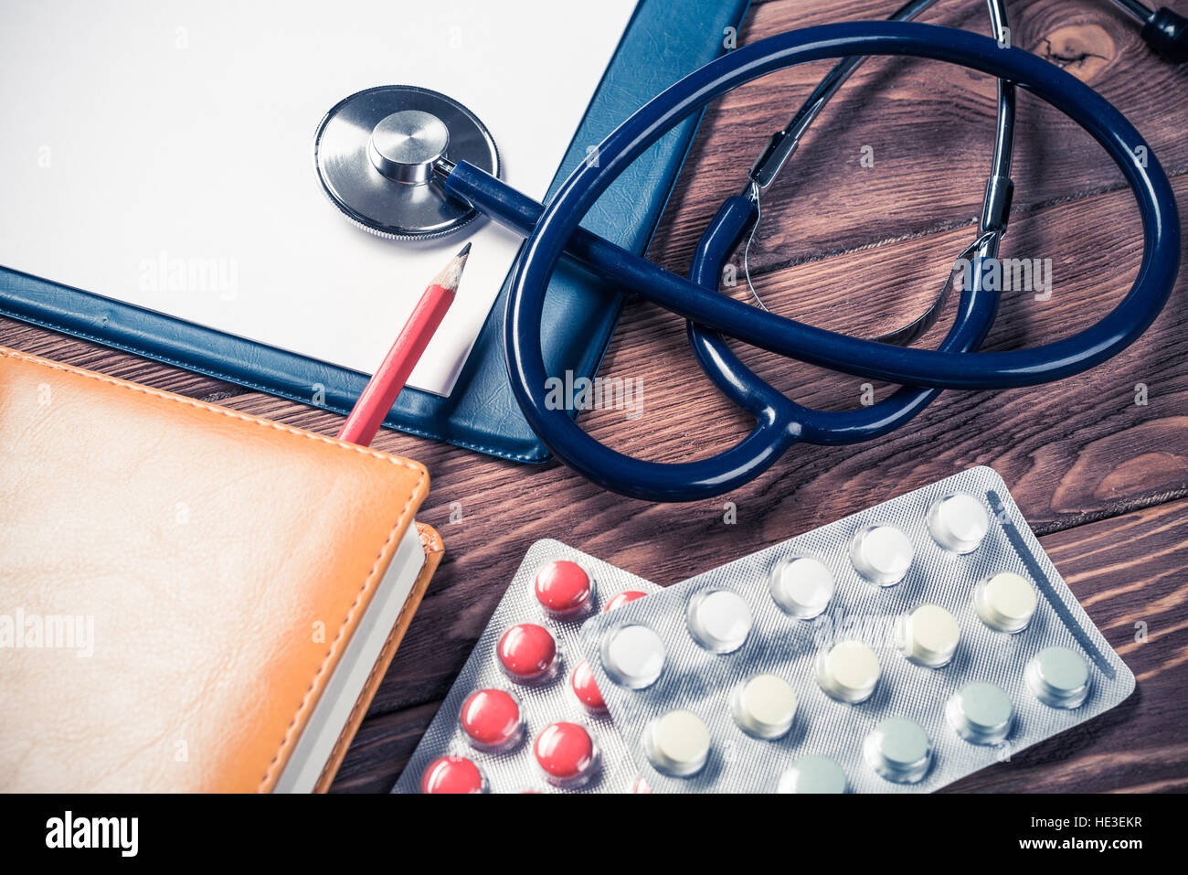 Desk of doctor with medicine things Stock Photo - Alamy