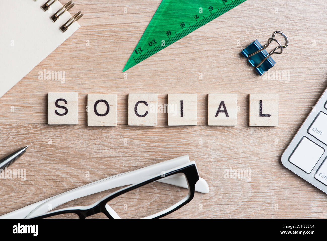 Elements of game with letters spelling business keywords on workplace ...