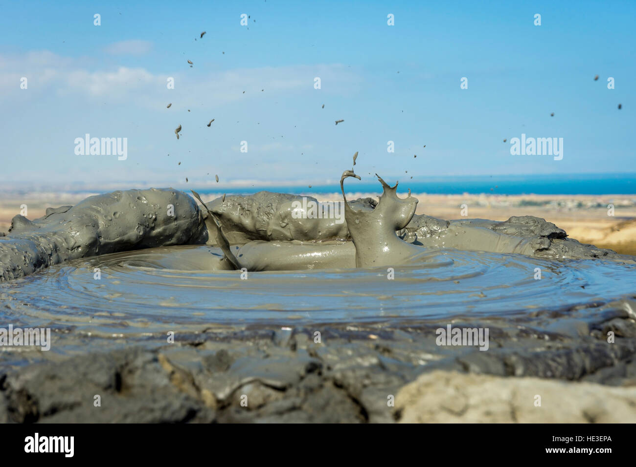 Mud volcano erupting mud bubble, Gobustan, Azerbaijan Stock Photo - Alamy
