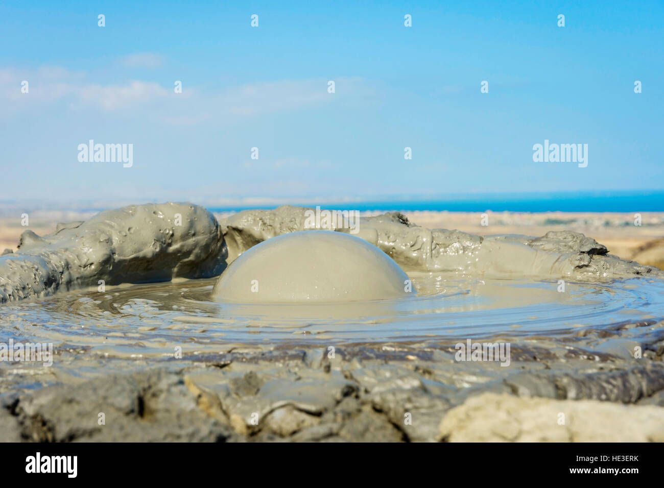 Mud volcano erupting mud bubble, Gobustan, Azerbaijan Stock Photo - Alamy