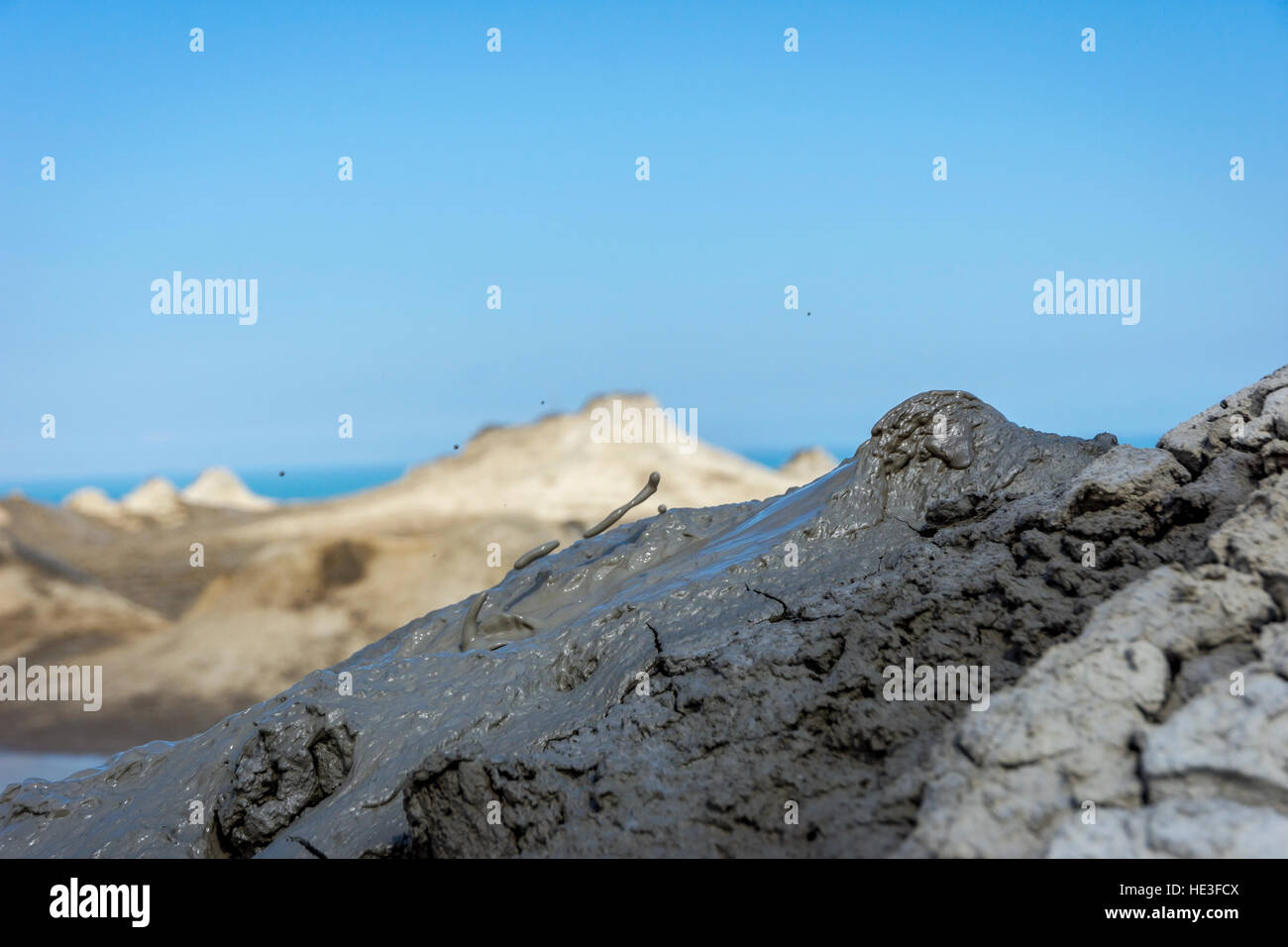 Mud volcano erupting mud, Gobustan park, Azerbaijan Stock Photo - Alamy