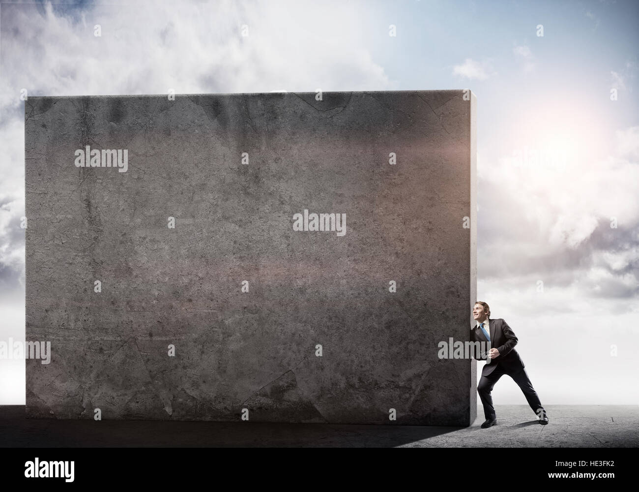 Businessman push wall Stock Photo - Alamy