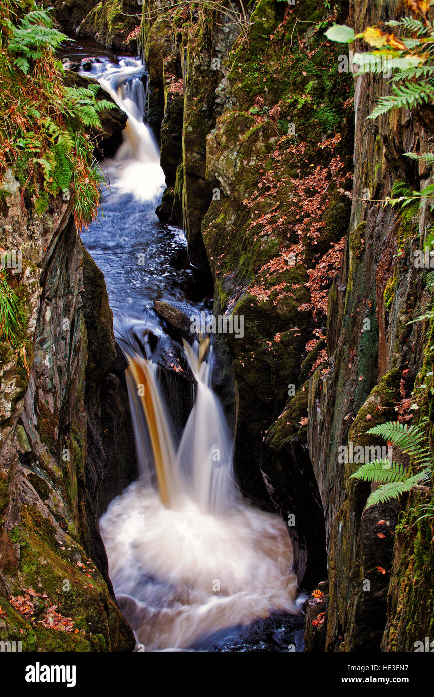 Snow falls flow through a narrow gully of rock Stock Photo - Alamy