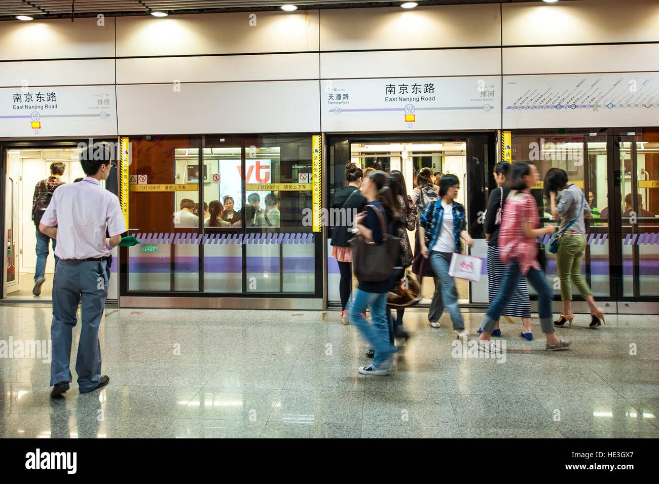 Commuters riding metro subway underground train platform stop Shanghai ...
