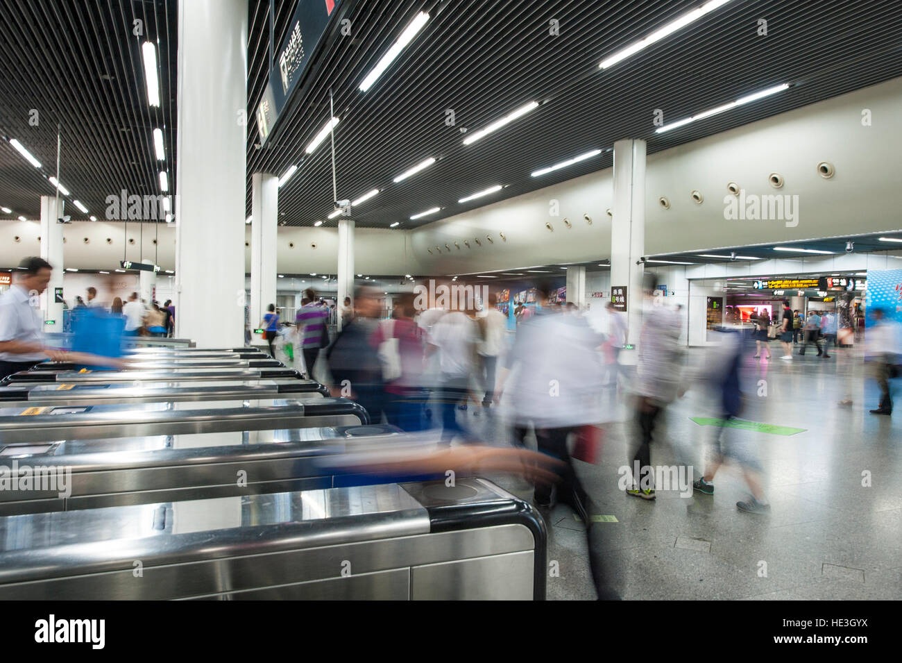 Commuters in metro subway underground stop station entrance Shanghai ...