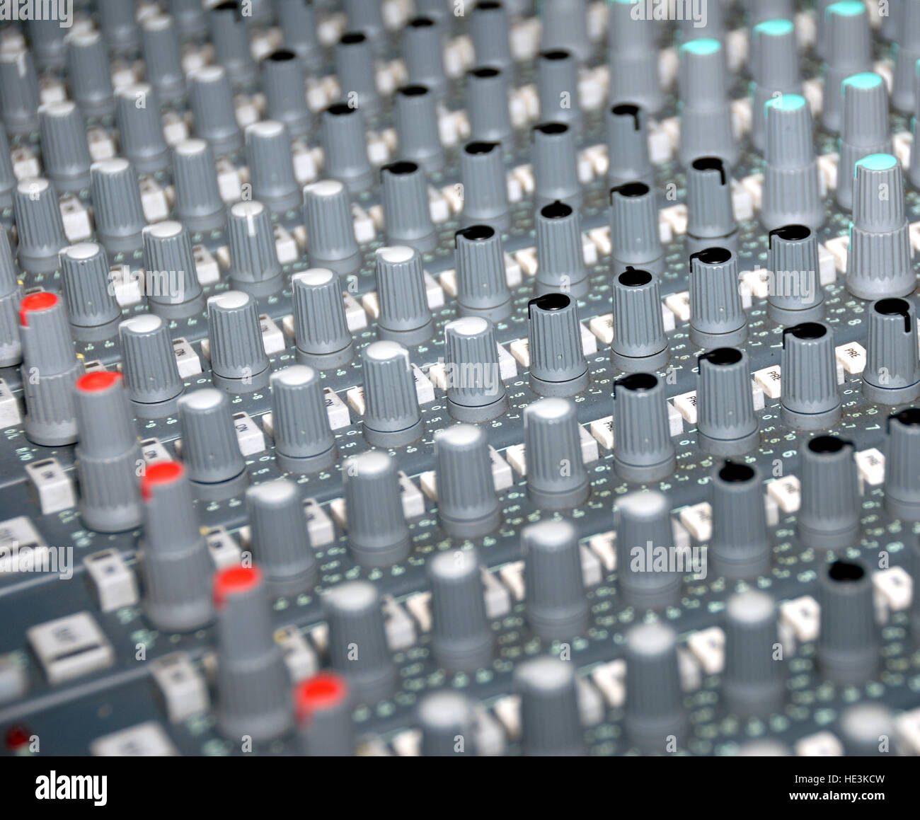 Audio mixing console in a recording studio. Faders and knobs of a sound ...