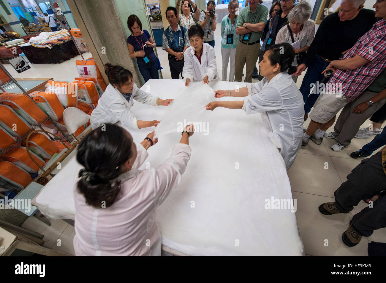 Factory workers stretching silk cloth at SIlk Spinning Mill Suzhou ...