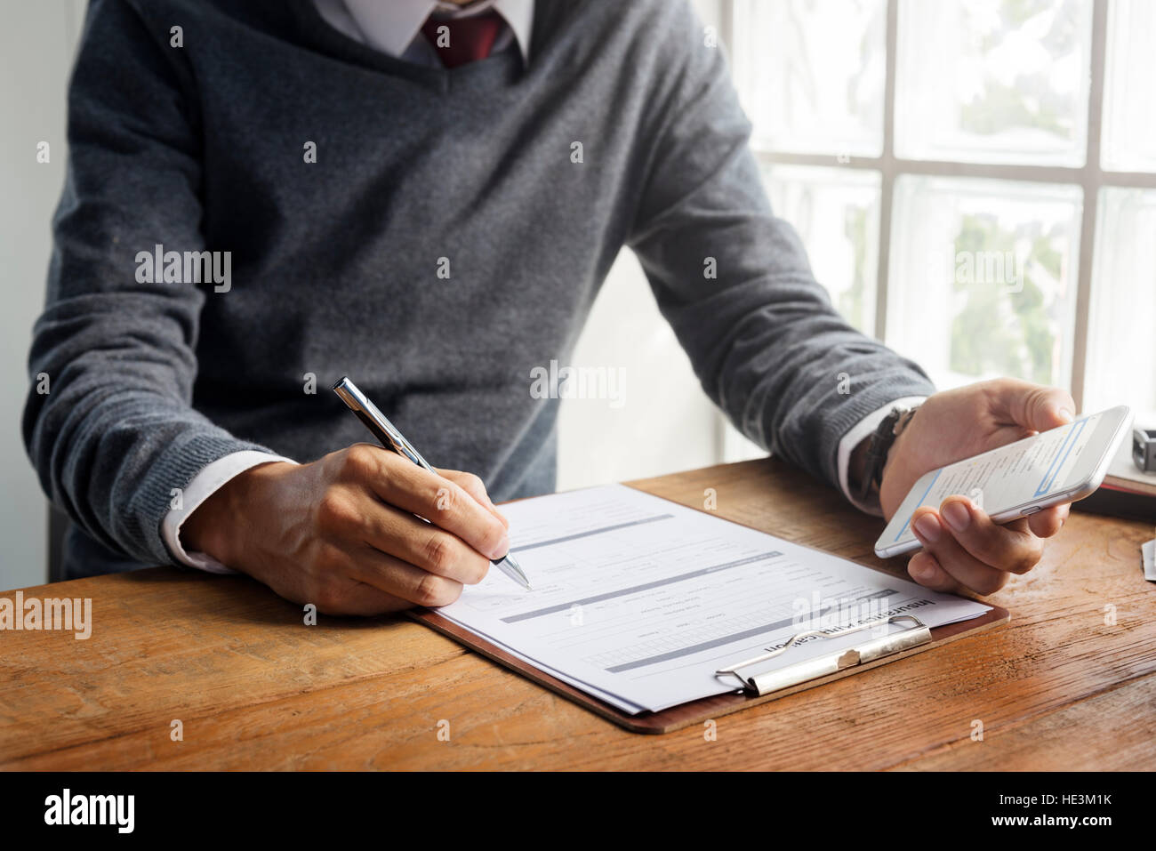 Man Writing Insurance Application Form Concept Stock Photo - Alamy