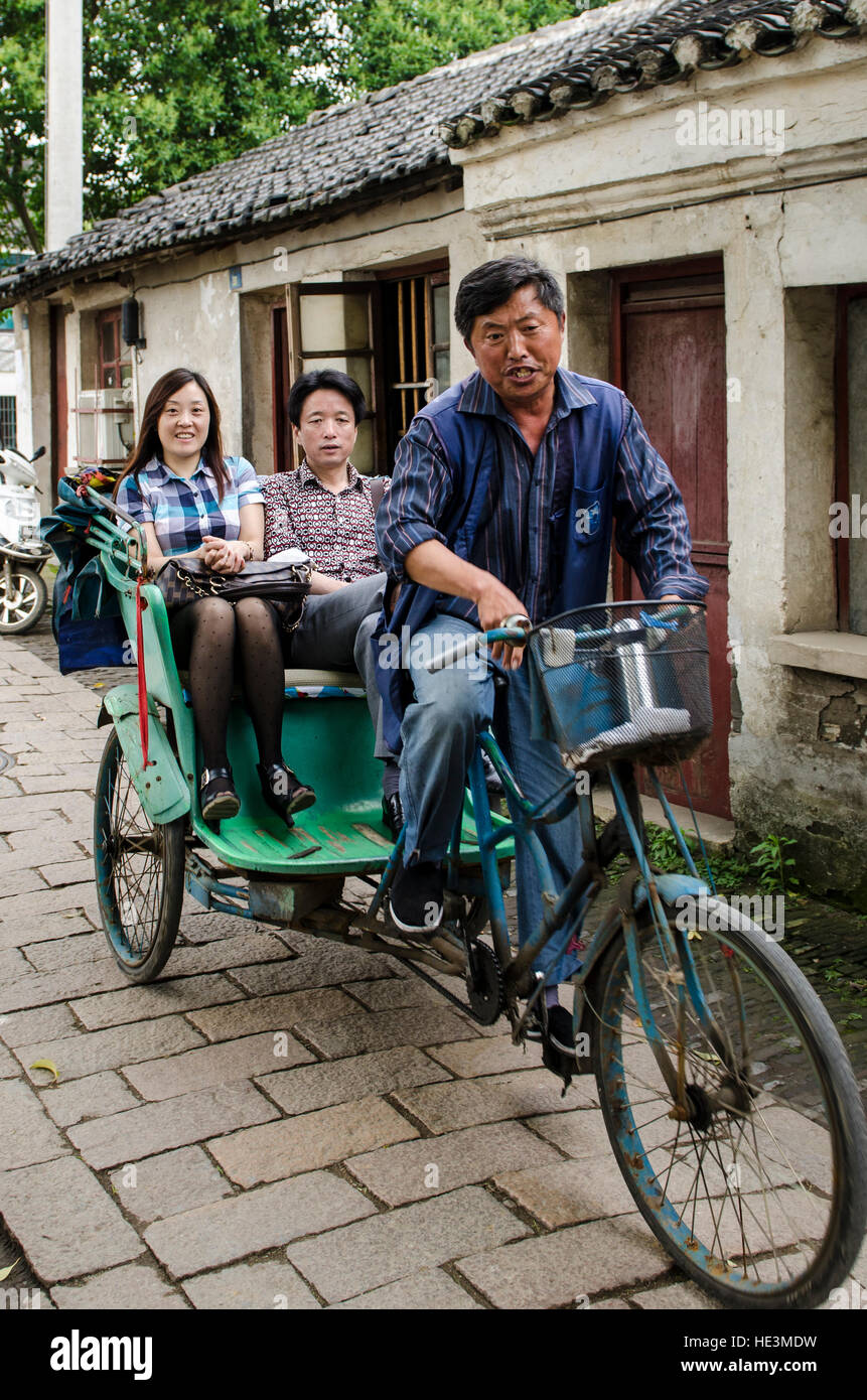 Cycle trishaw rickshaw taxi driver tour of the water village of Tongli ...