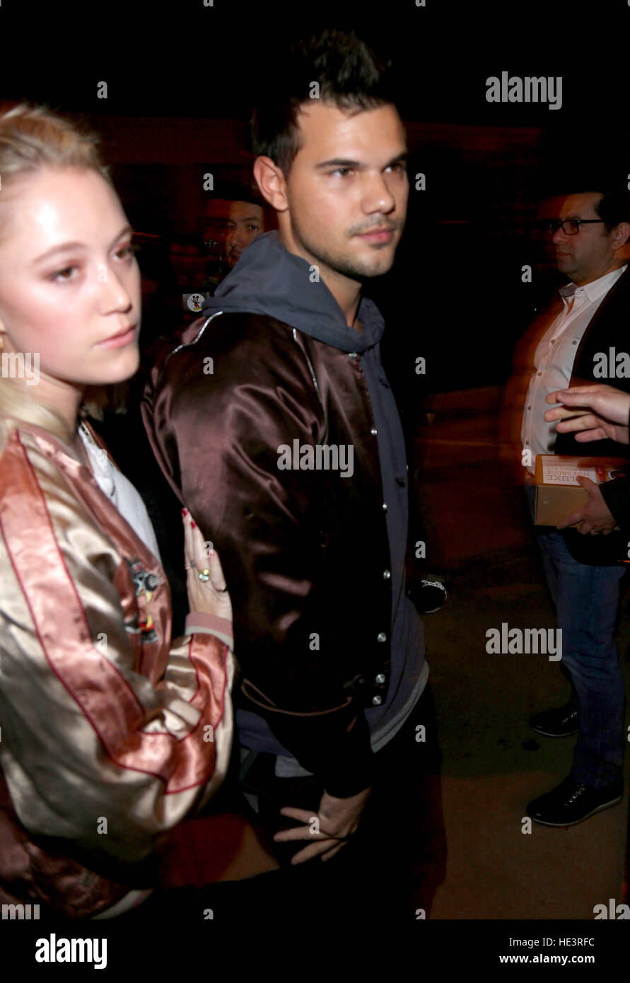 Taylor Lautner and his girlfriend arrive at Catch, a restaurant in West ...