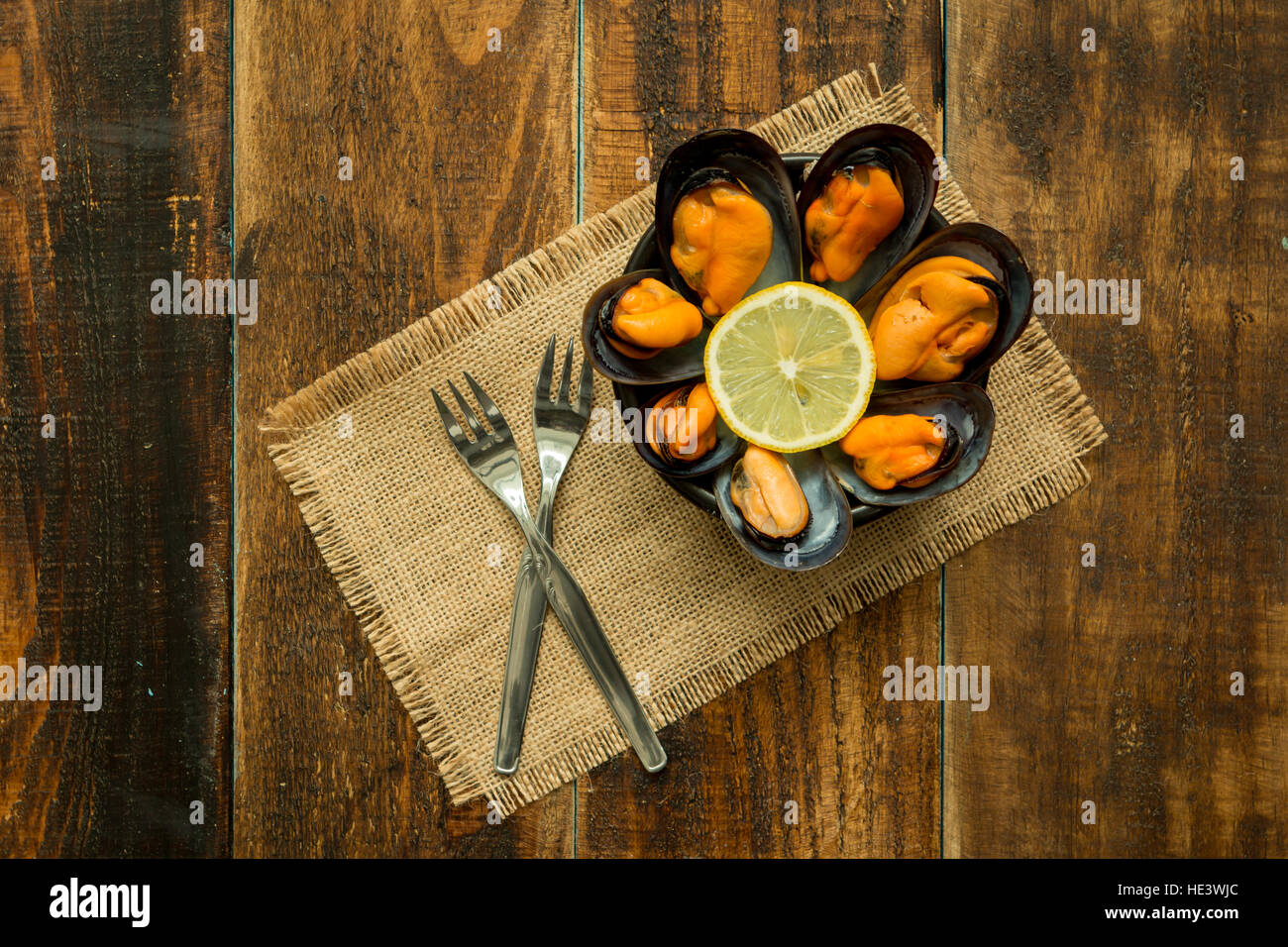 Delicius appetizer with natural mussels and lemon Stock Photo - Alamy