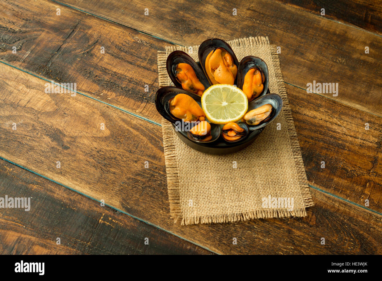 Delicius appetizer with natural mussels and lemon Stock Photo - Alamy