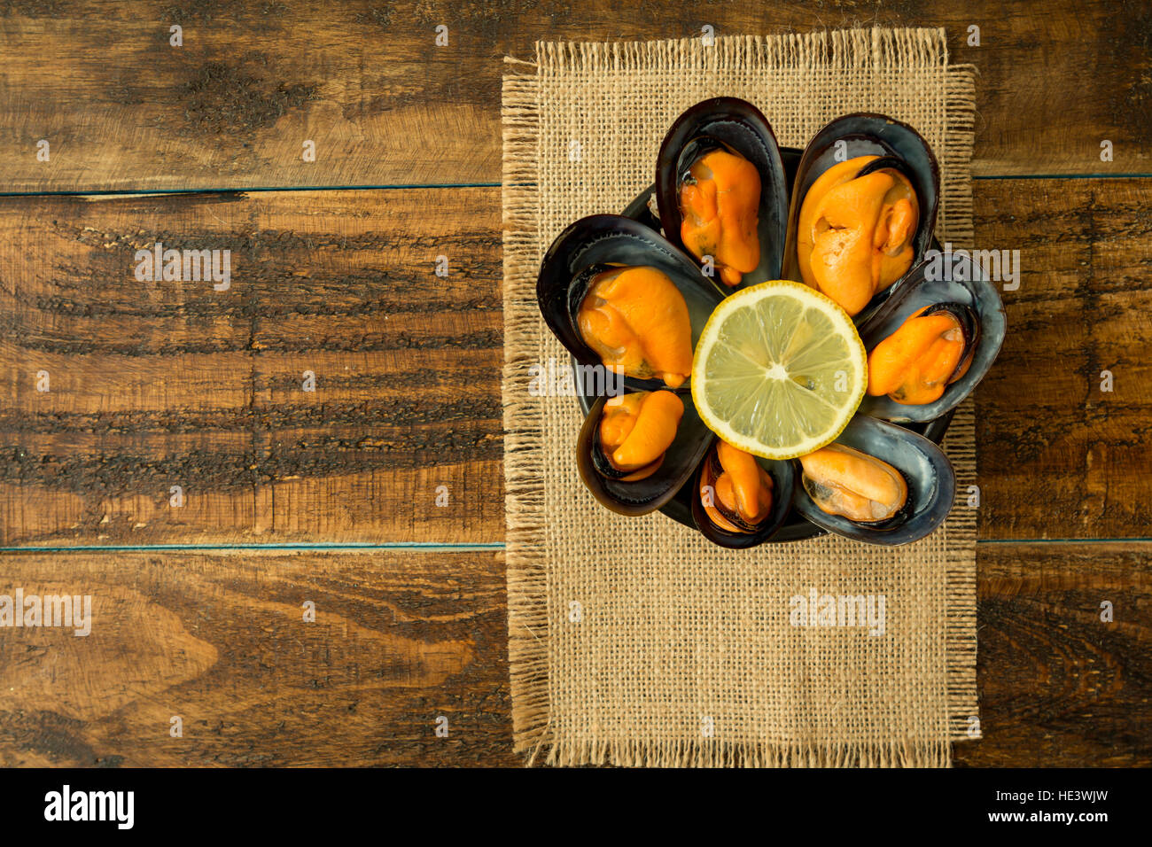Delicius appetizer with natural mussels and lemon Stock Photo - Alamy