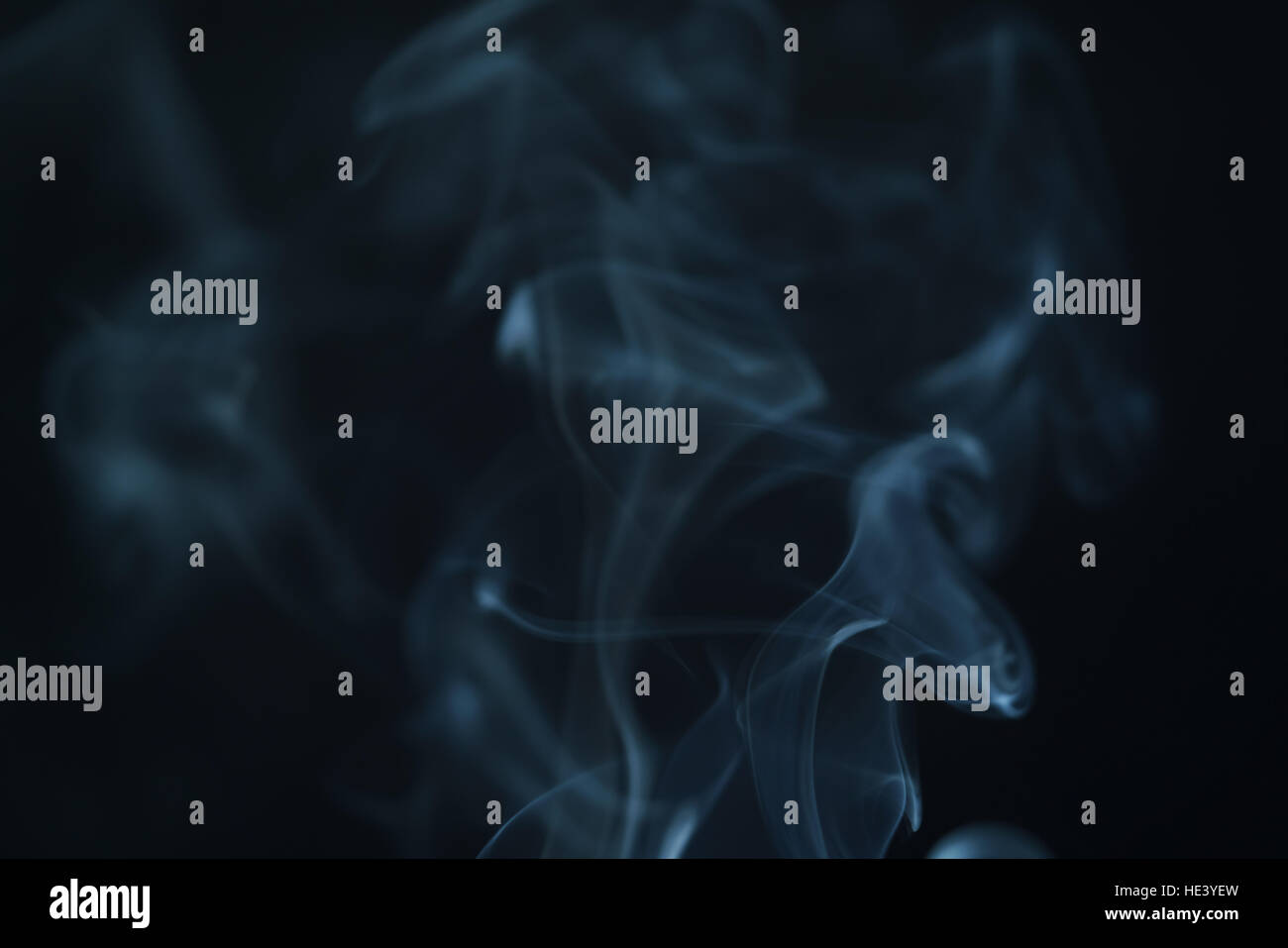 real blue smoke background in dark environment Stock Photo - Alamy