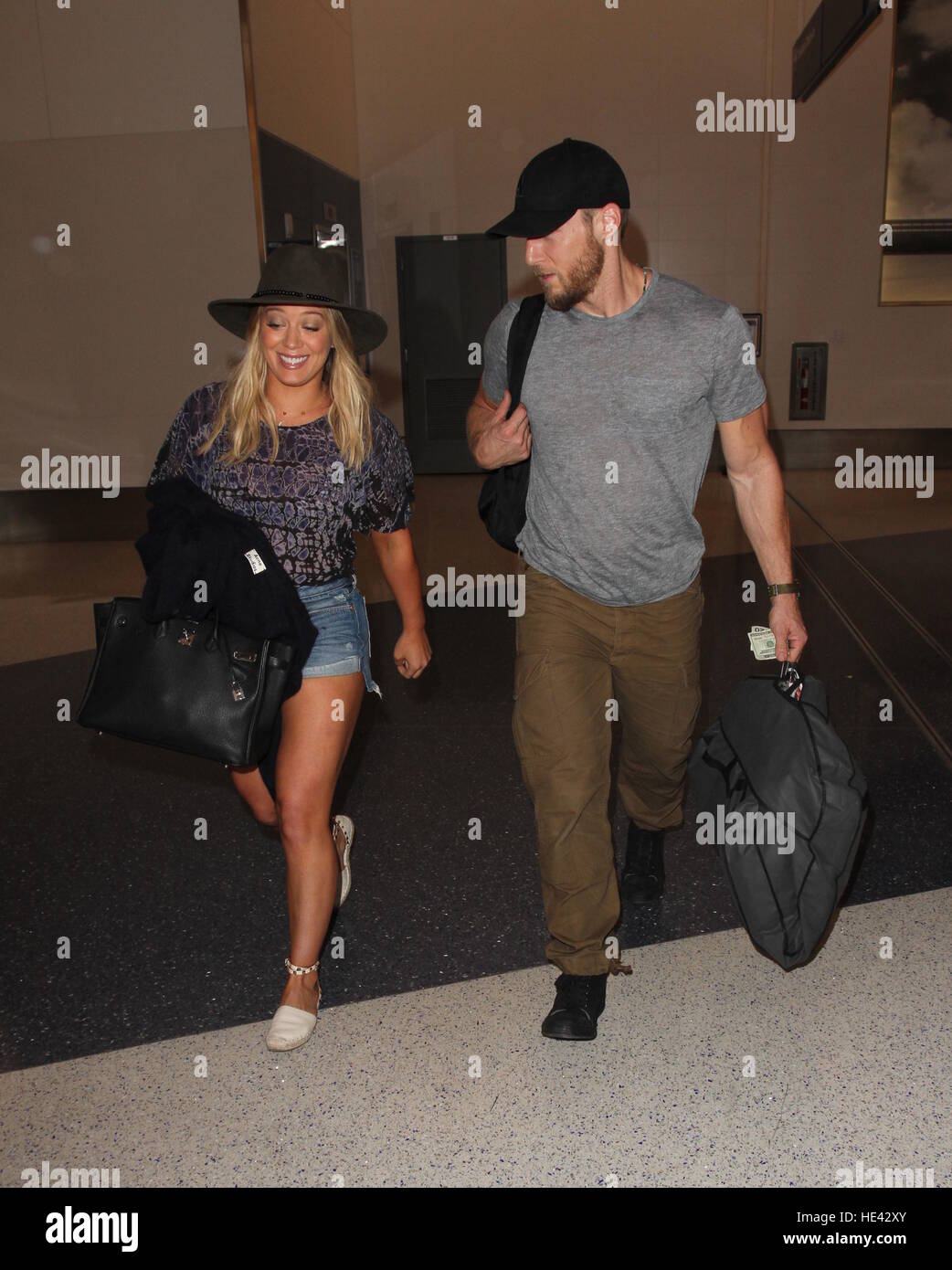 Hilary Duff departs from the airport with her new boyfriend Jason Walsh ...