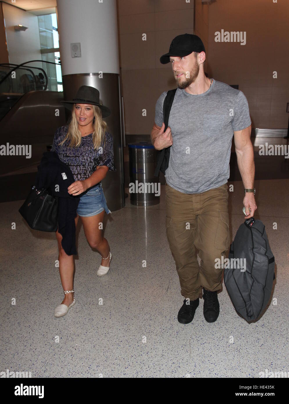 Hilary Duff departs from the airport with her new boyfriend Jason Walsh ...