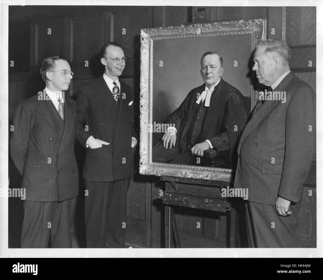 This historical photograph captures the unveiling of the portrait of ...