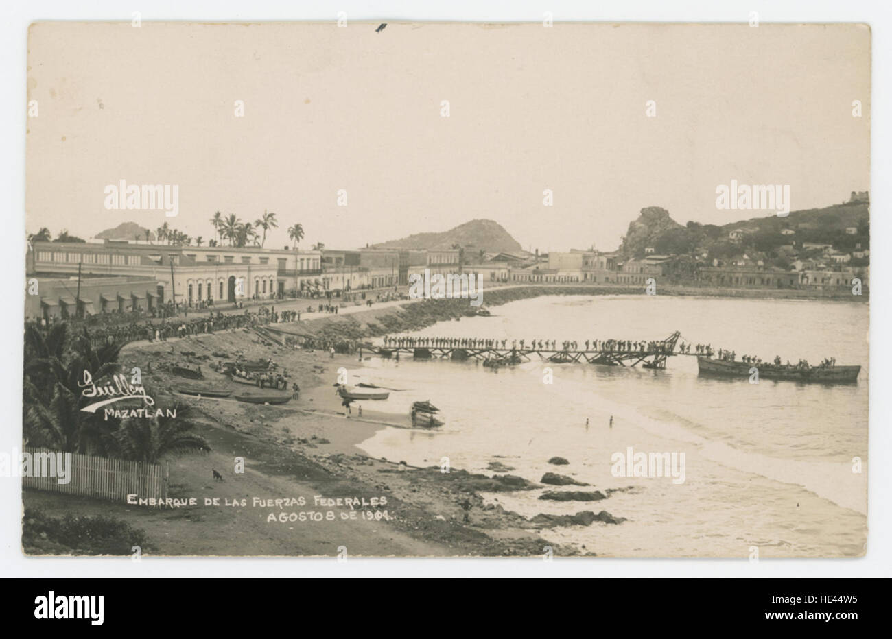 This historical photograph captures an old embarkation scene, showing ...
