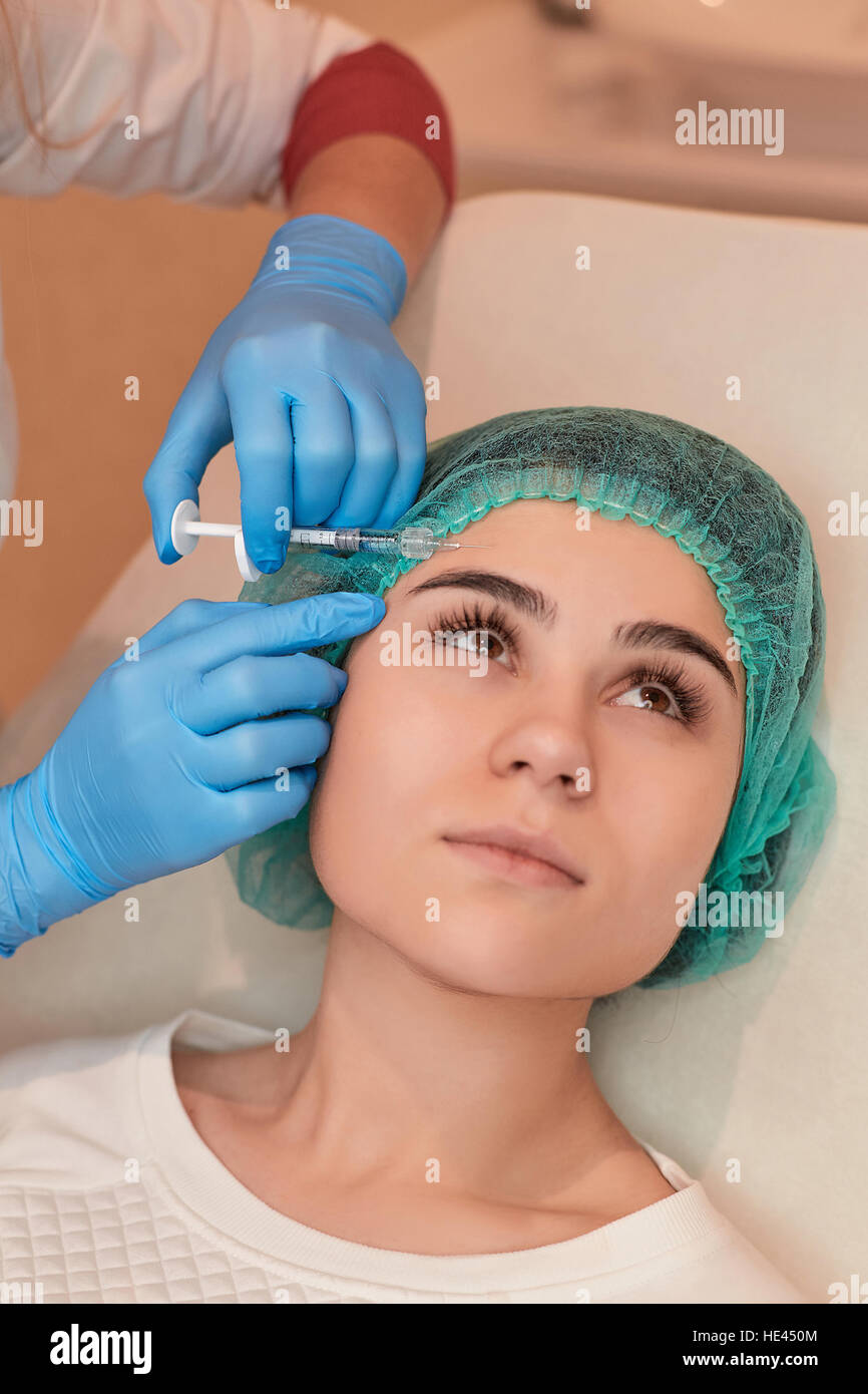 Beautiful woman gets injections Stock Photo - Alamy
